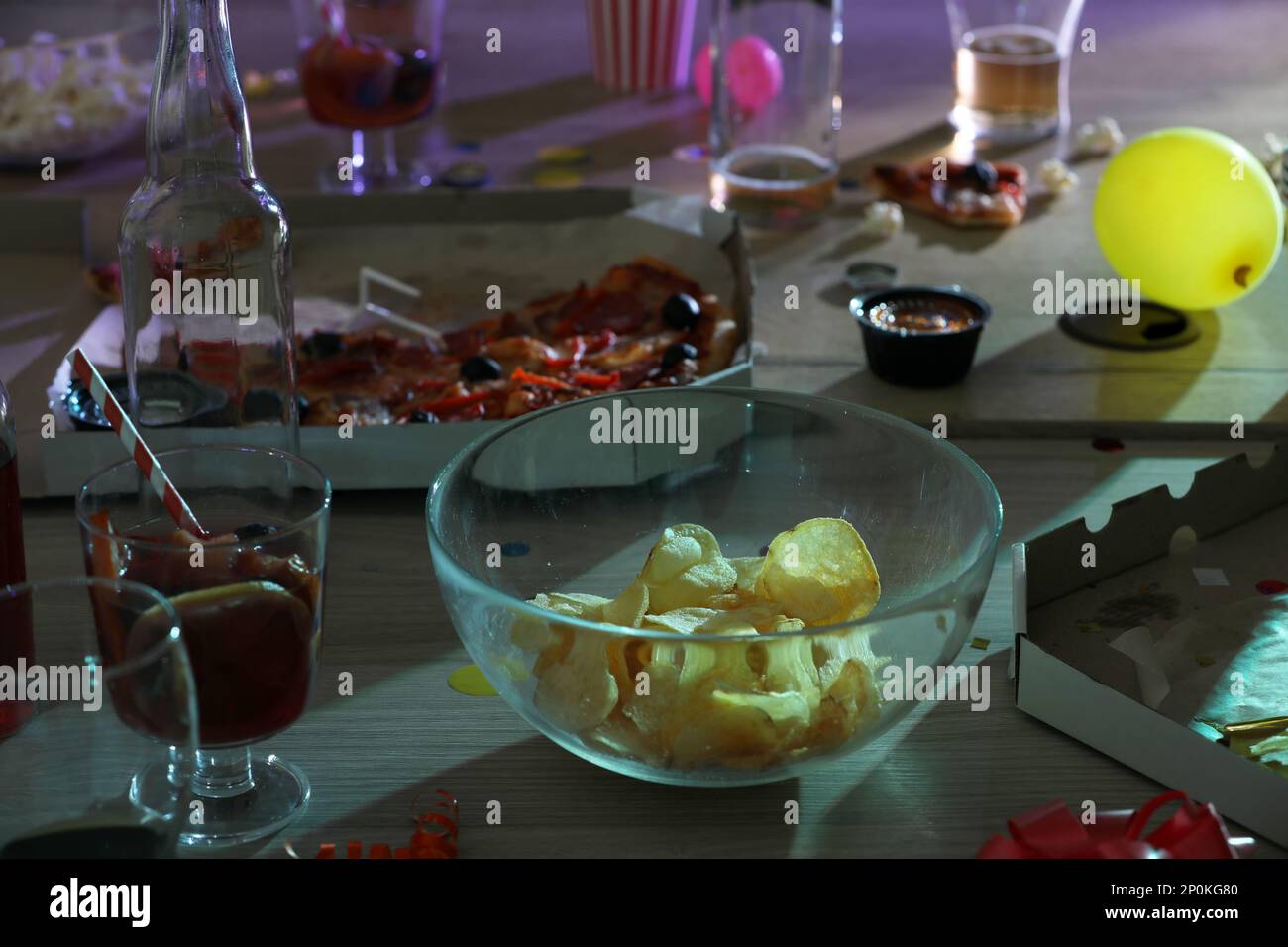 View of messy table with drinks and leftovers after party Stock Photo ...
