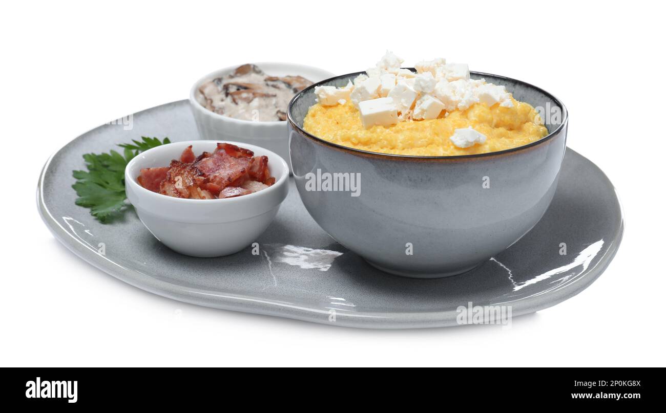 Tasty banosh with brynza, pork cracklings and mushrooms on white ...