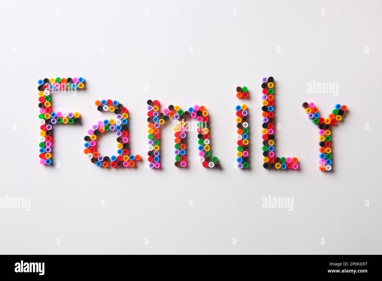 Word Family made of melty beads on white background, flat lay Stock ...