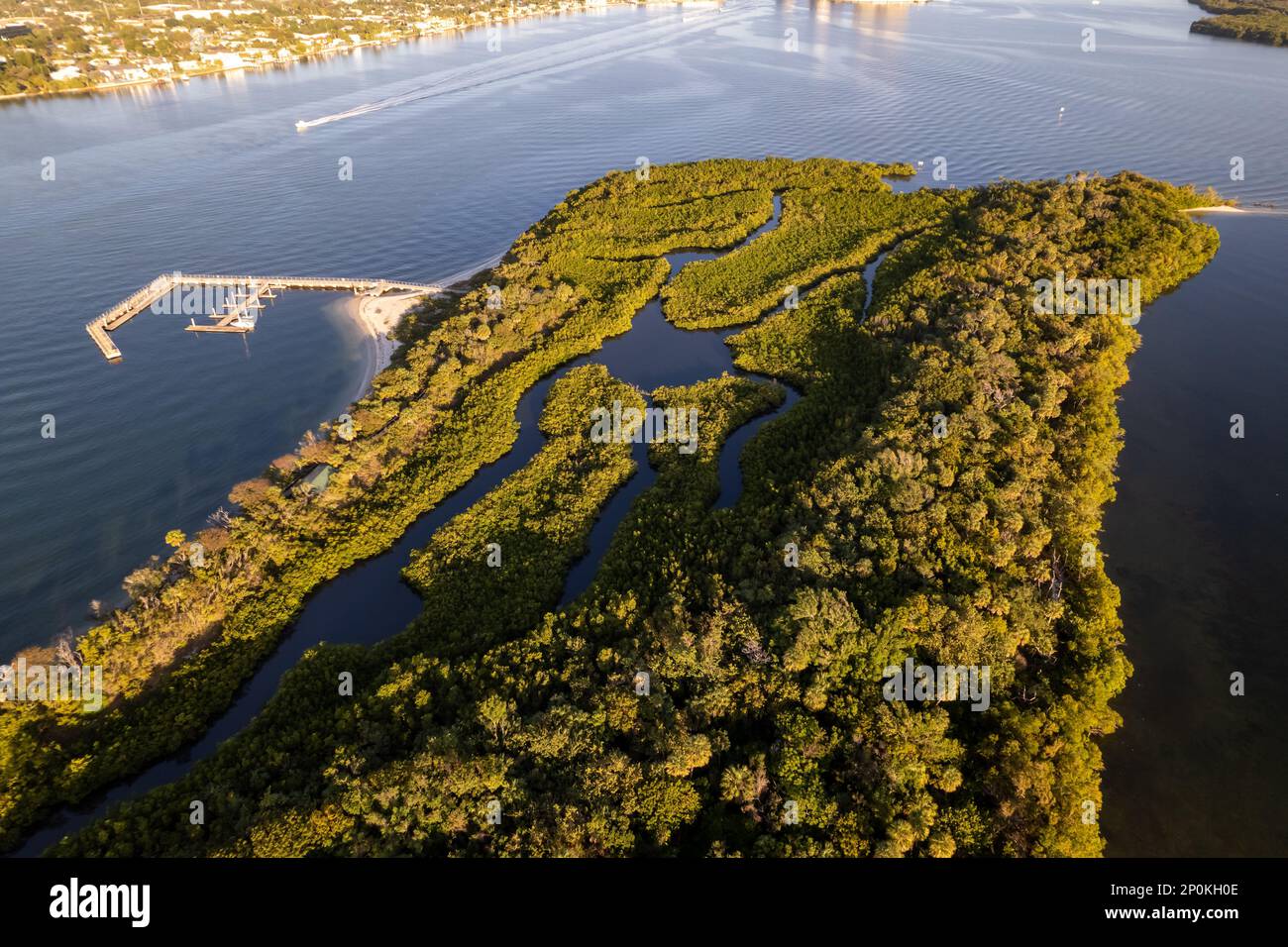 An aerial view of a small island surrounded by waters in North Palm ...