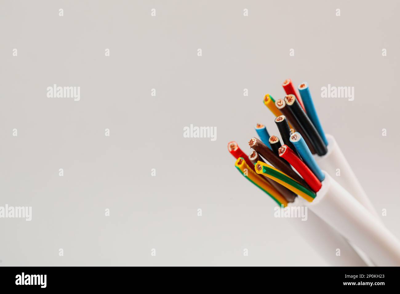 Cables with wires on light background, closeup. Space for text Stock ...