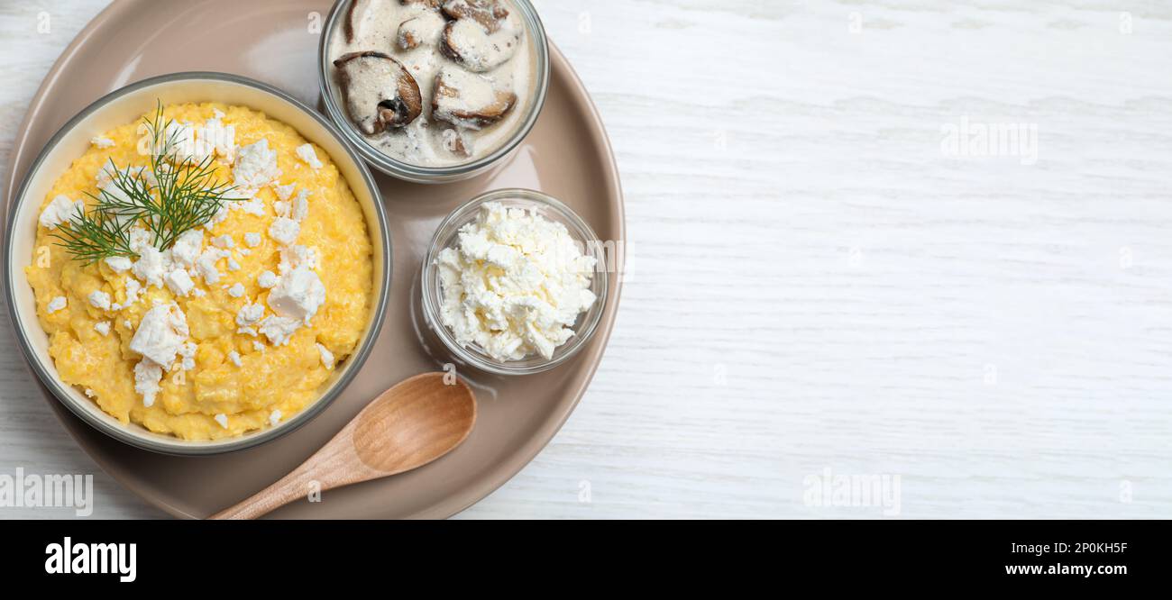 Delicious traditional banosh served on white wooden table, top view ...