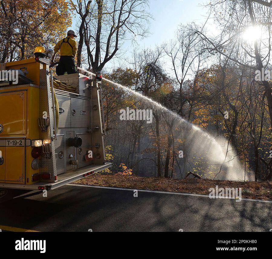 Firefighter Stuart Kocha, with Dana Fire Department, puts out some hot ...