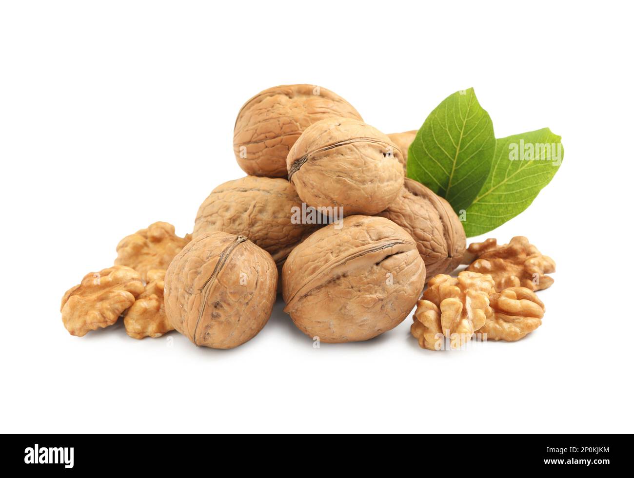 Pile of ripe walnuts and leaves on white background Stock Photo - Alamy