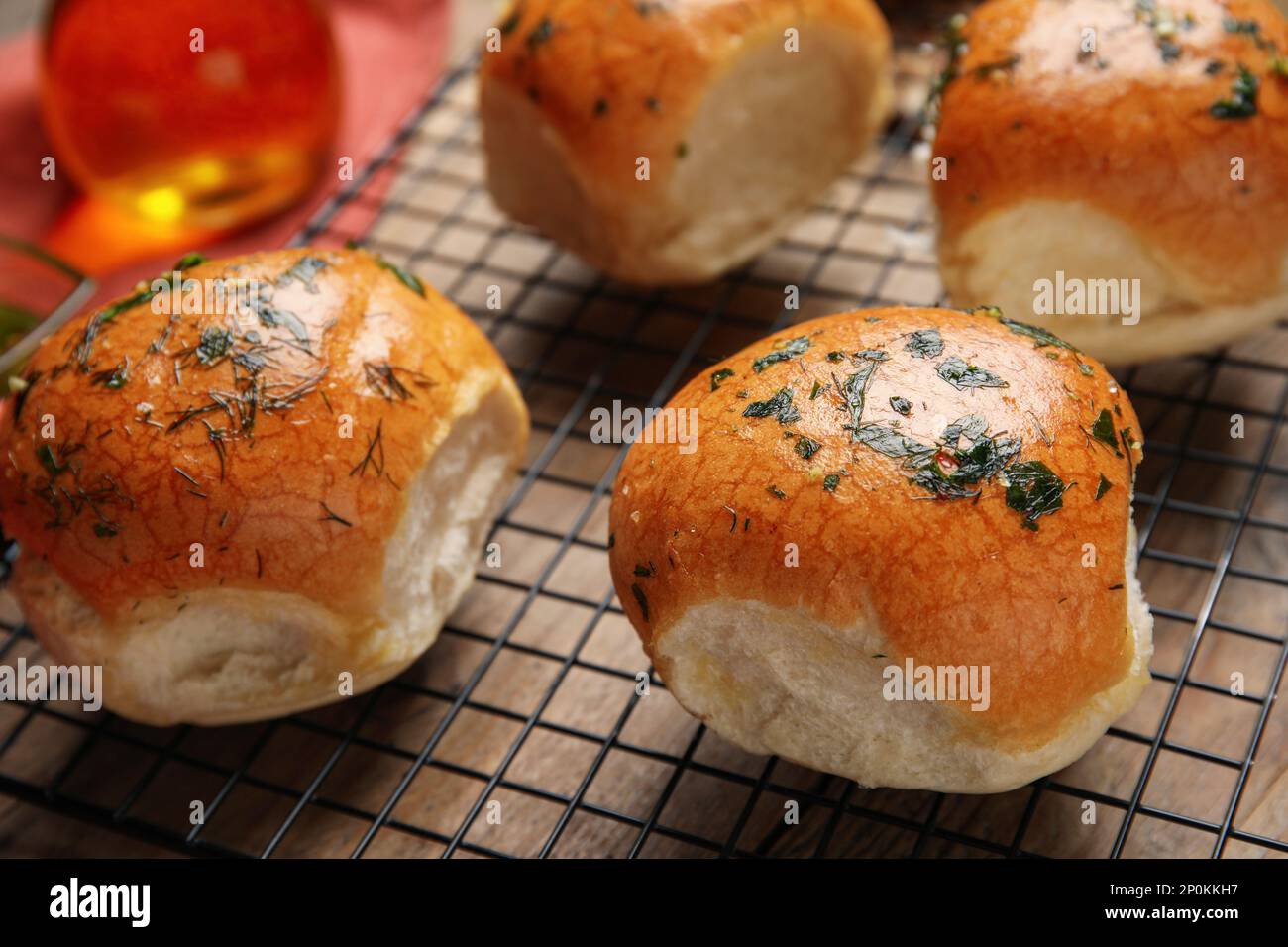 Traditional Ukrainian bread (Pampushky) with garlic on baking grid ...