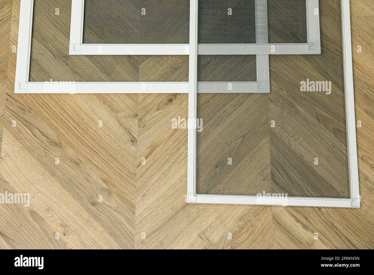 Set of window screens on wooden floor, flat lay. Space for text Stock ...