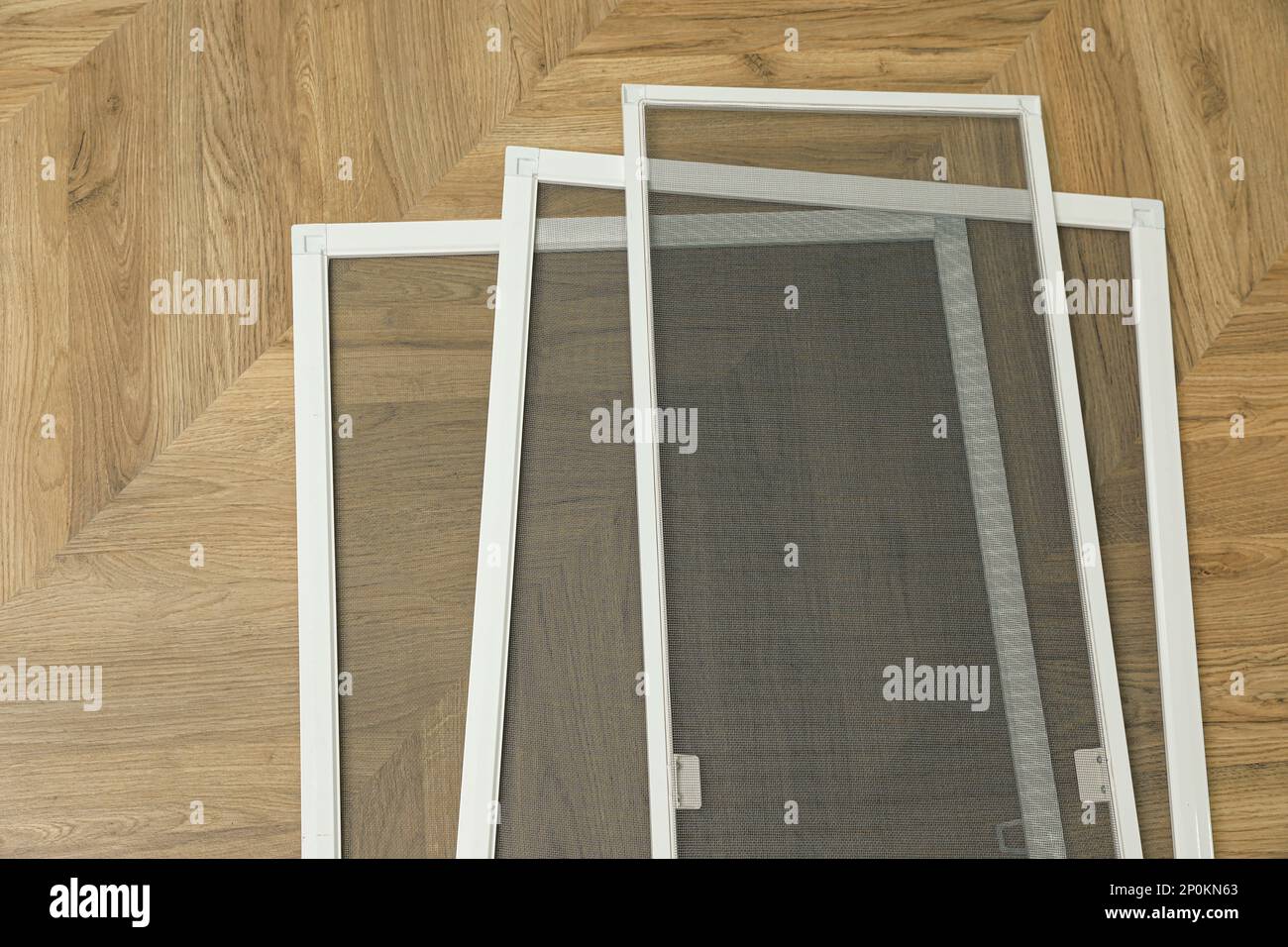Set of window screens on wooden floor, flat lay Stock Photo - Alamy