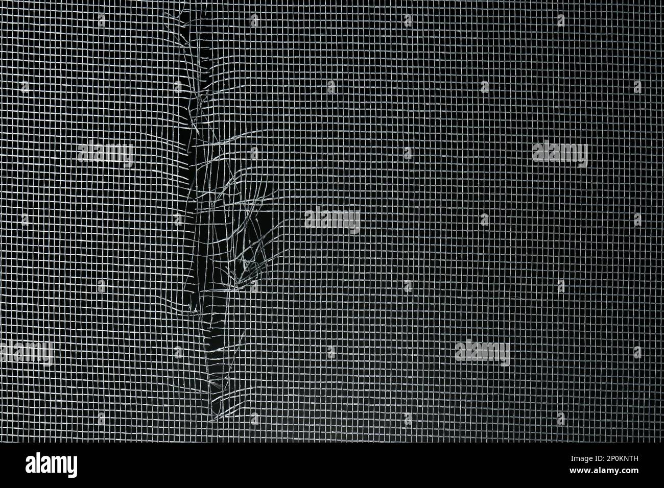 Torn window screen against black background, closeup Stock Photo - Alamy