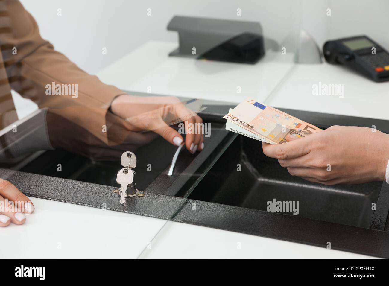 Man giving money to cashier in bank, closeup. Currency exchange Stock ...