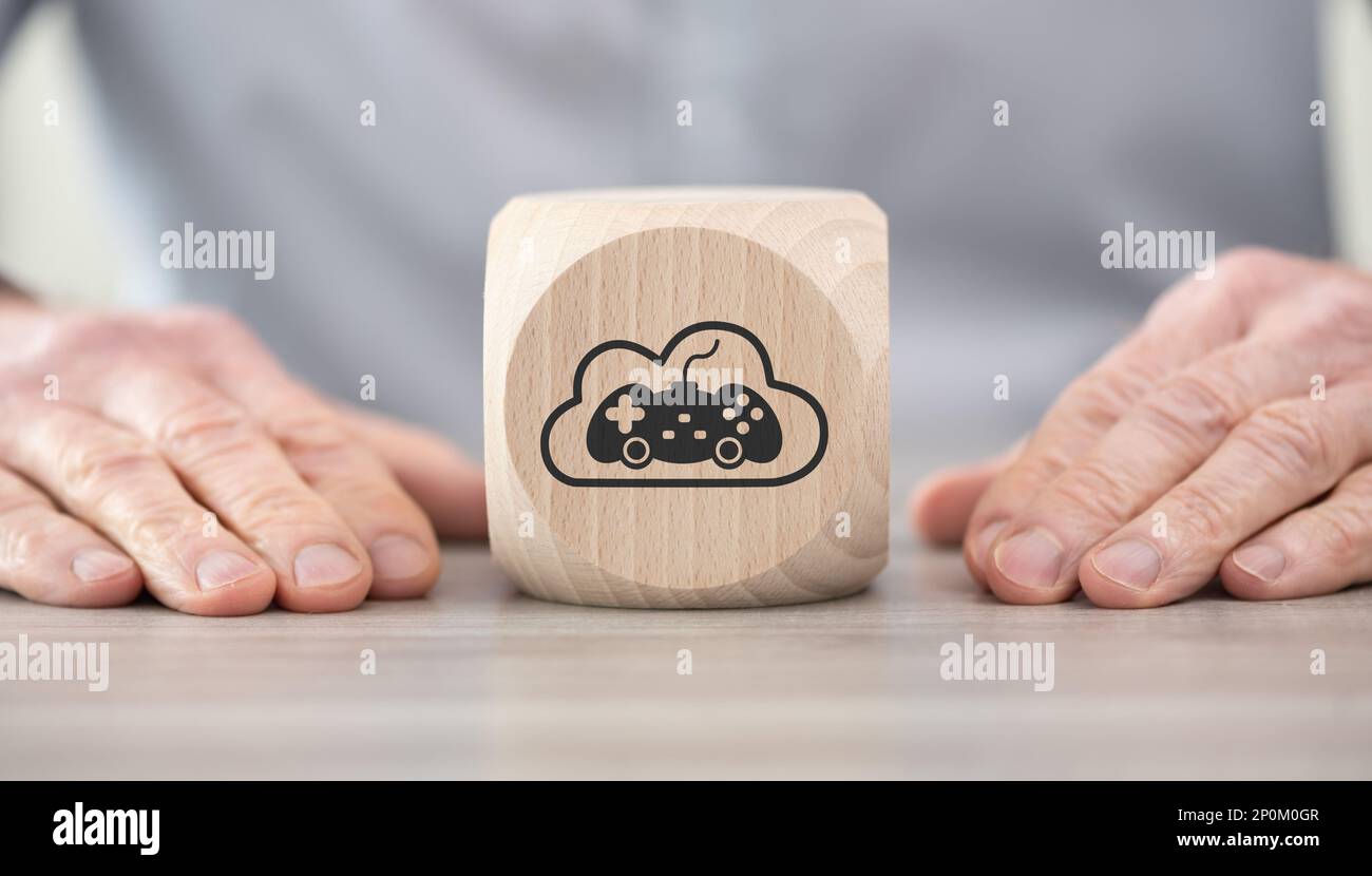 Wooden block with symbol of cloud gaming concept Stock Photo - Alamy
