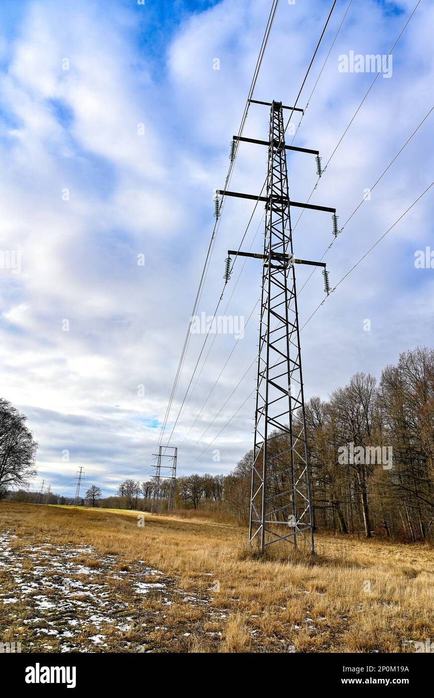 powerline in silhouette on cloudy light sky Stock Photo - Alamy
