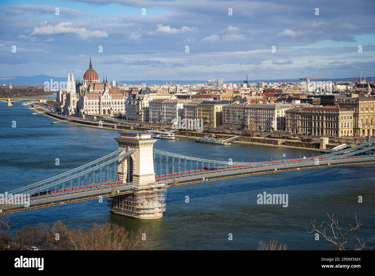 The Szechenyi Chain Bridge under renovation and Hungarian parliament ...