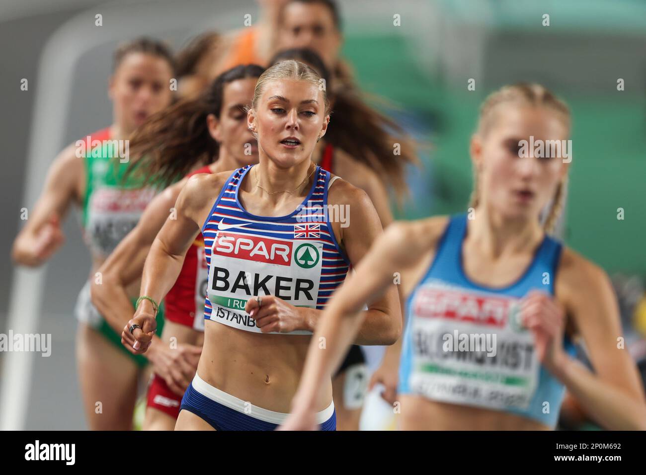 Ellie Baker, of Great Britain, center, runs in a Women 1500 meters heat ...