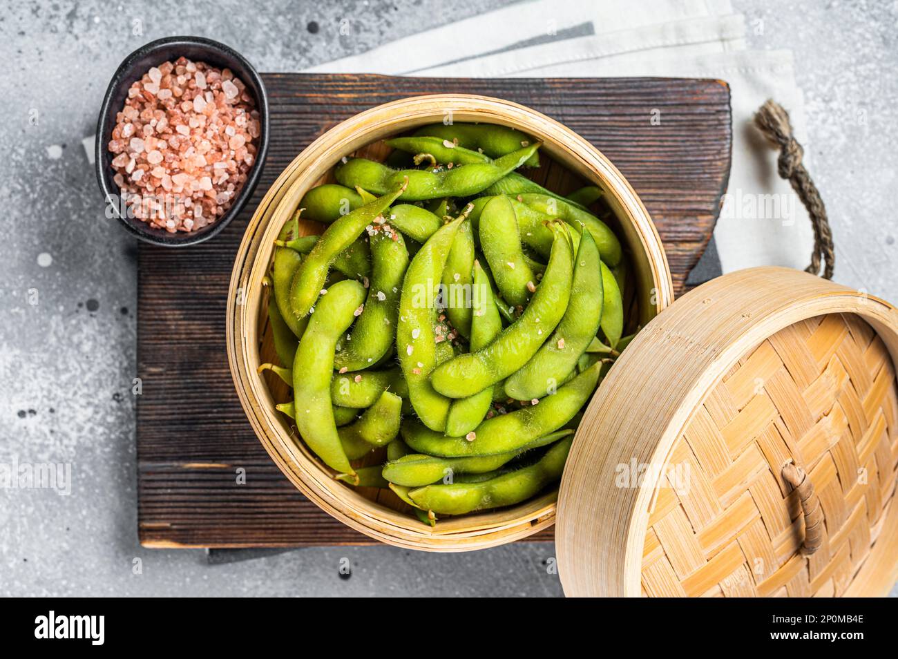 Steamed Edamame Beans with sea salt, soy beans. Gray background. Top ...