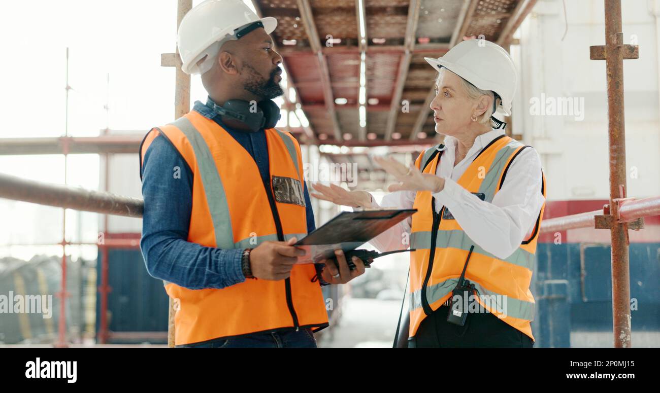 Construction, inspection and clipboard, black man and woman discussion ...