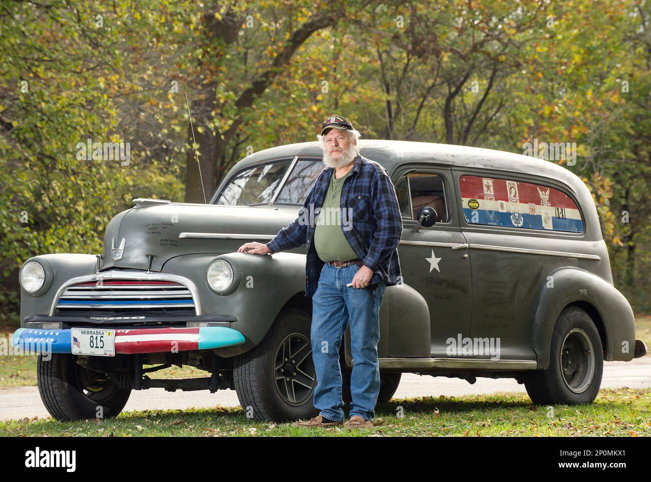 Army veteran Sam Aughe, of Crete, Neb., poses next to his 1946 ...