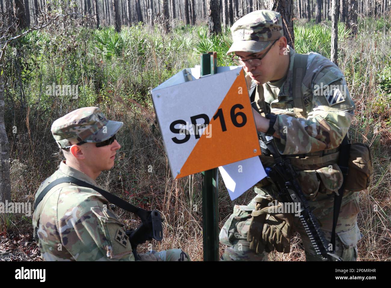 3rd Infantry Division Soldiers review their land navigation coordinates ...