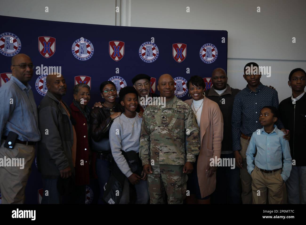 Lieutenant Colonel Earnest Hearn poses for photos with his family and ...
