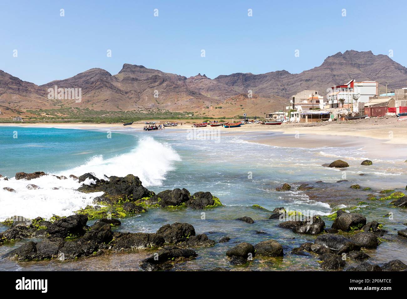 Sao pedro fishing village near a beautiful sandy beach with mountains ...