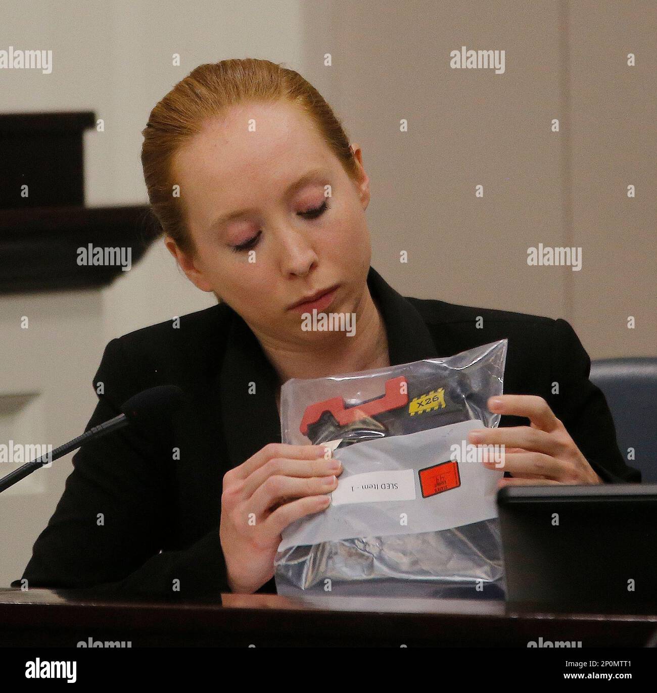 Witness, crime scene investigator, Jamie Johnson looks over former ...