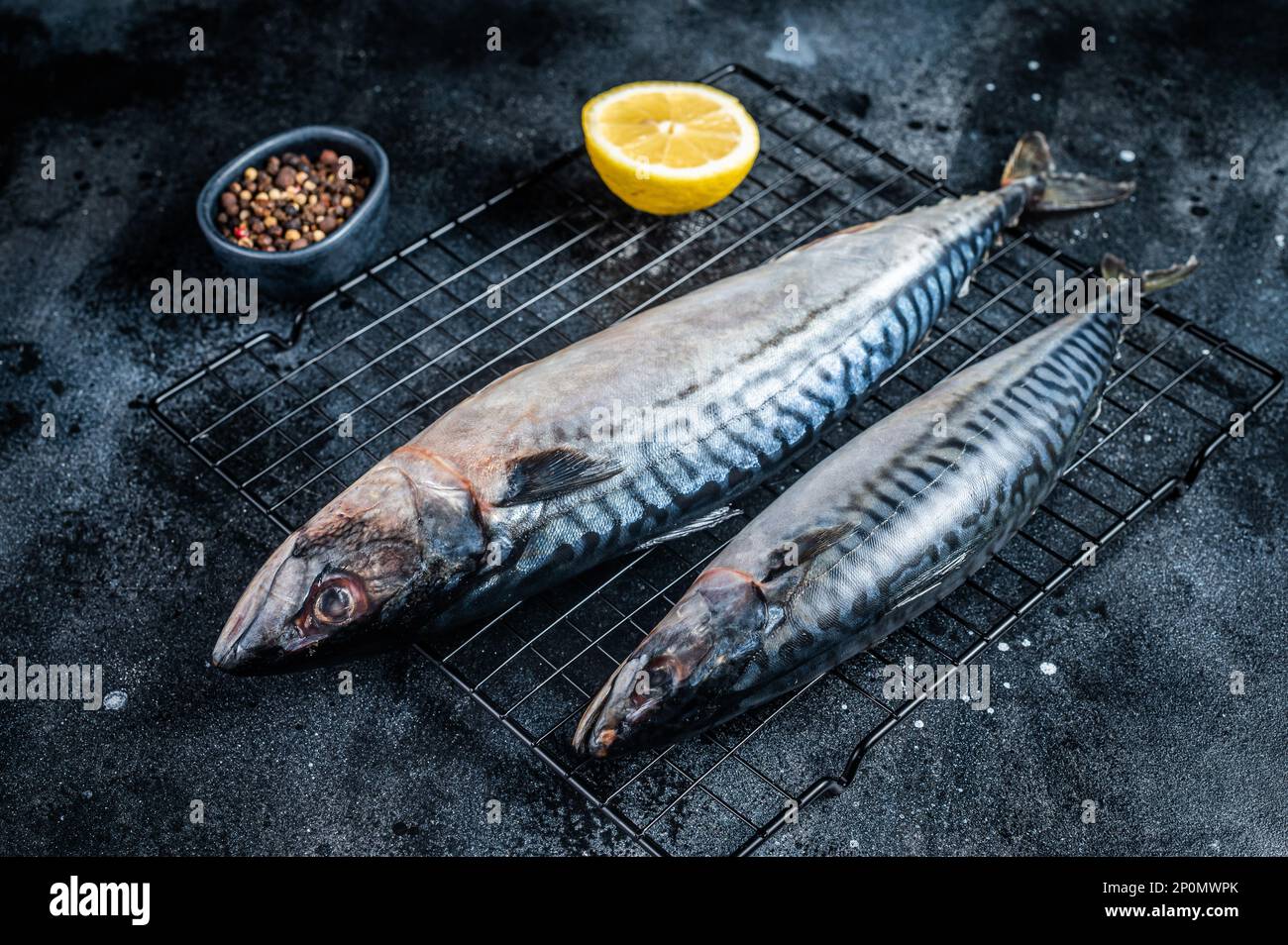 Fresh Raw mackerel scomber fish ready for grilling. Black background ...