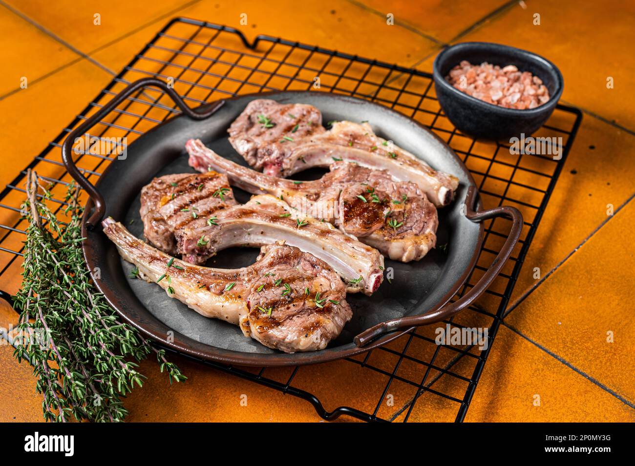 BBQ with Grilled lamb meat chops, mutton steaks with herbs. Orange ...