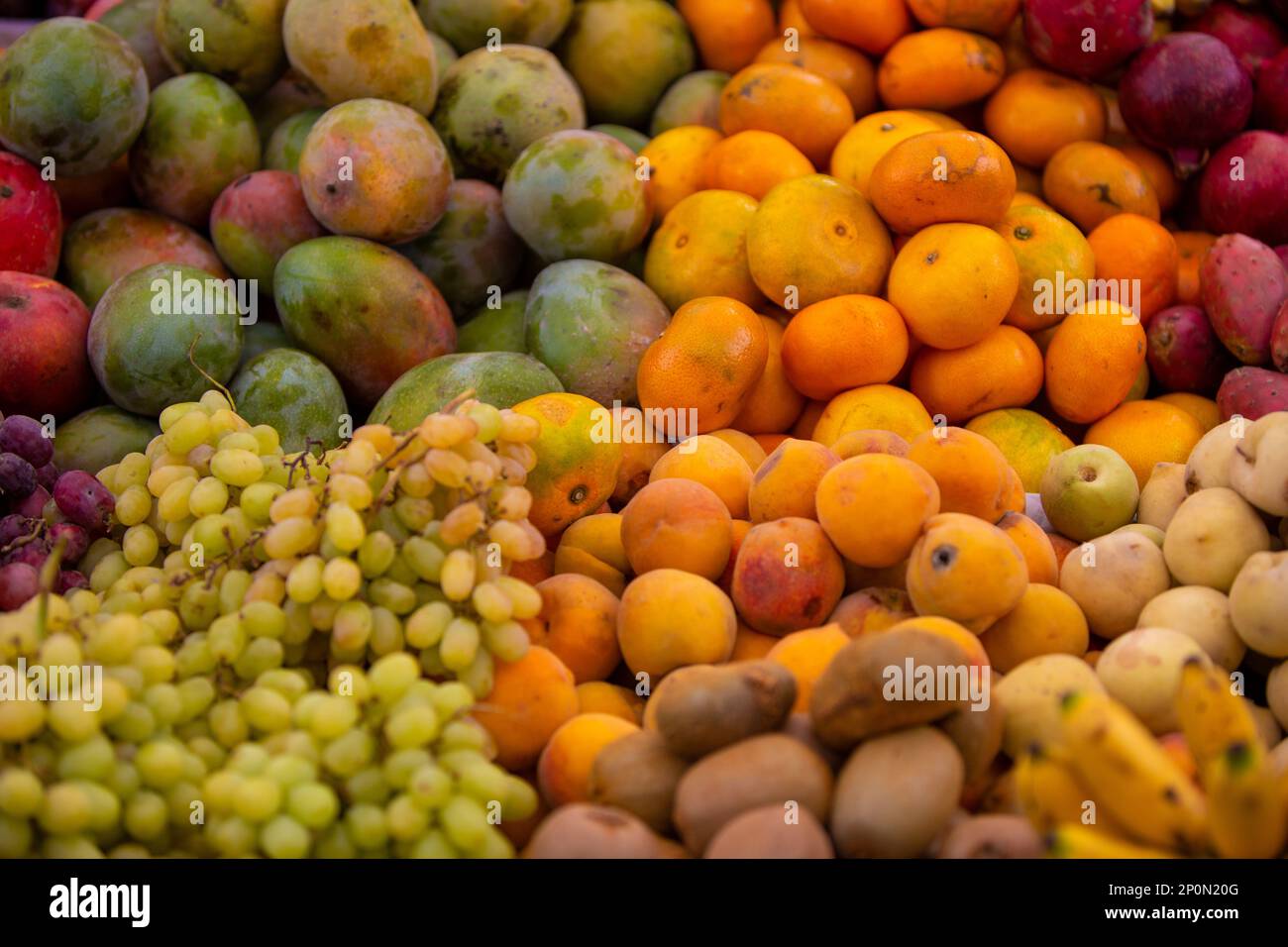 Variety of different fruits at a market Stock Photo - Alamy
