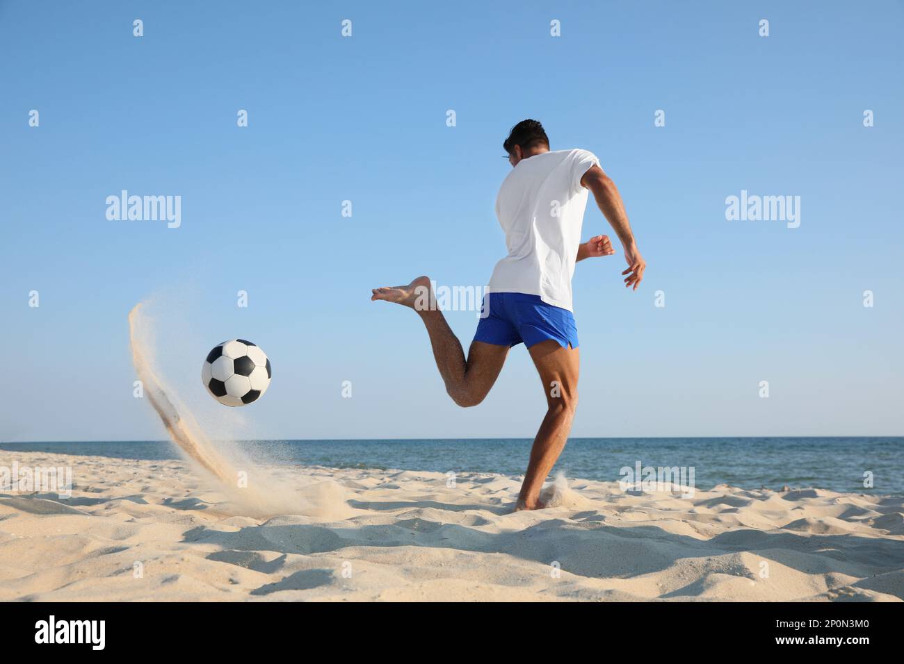 Man playing football hi-res stock photography and images - Alamy