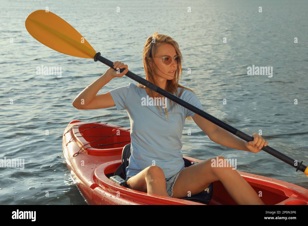 Beautiful woman kayaking on river. Summer activity Stock Photo - Alamy