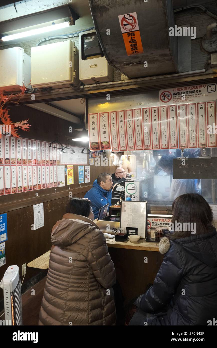 Small alleyway in Japan full of restaurants and people Stock Photo - Alamy