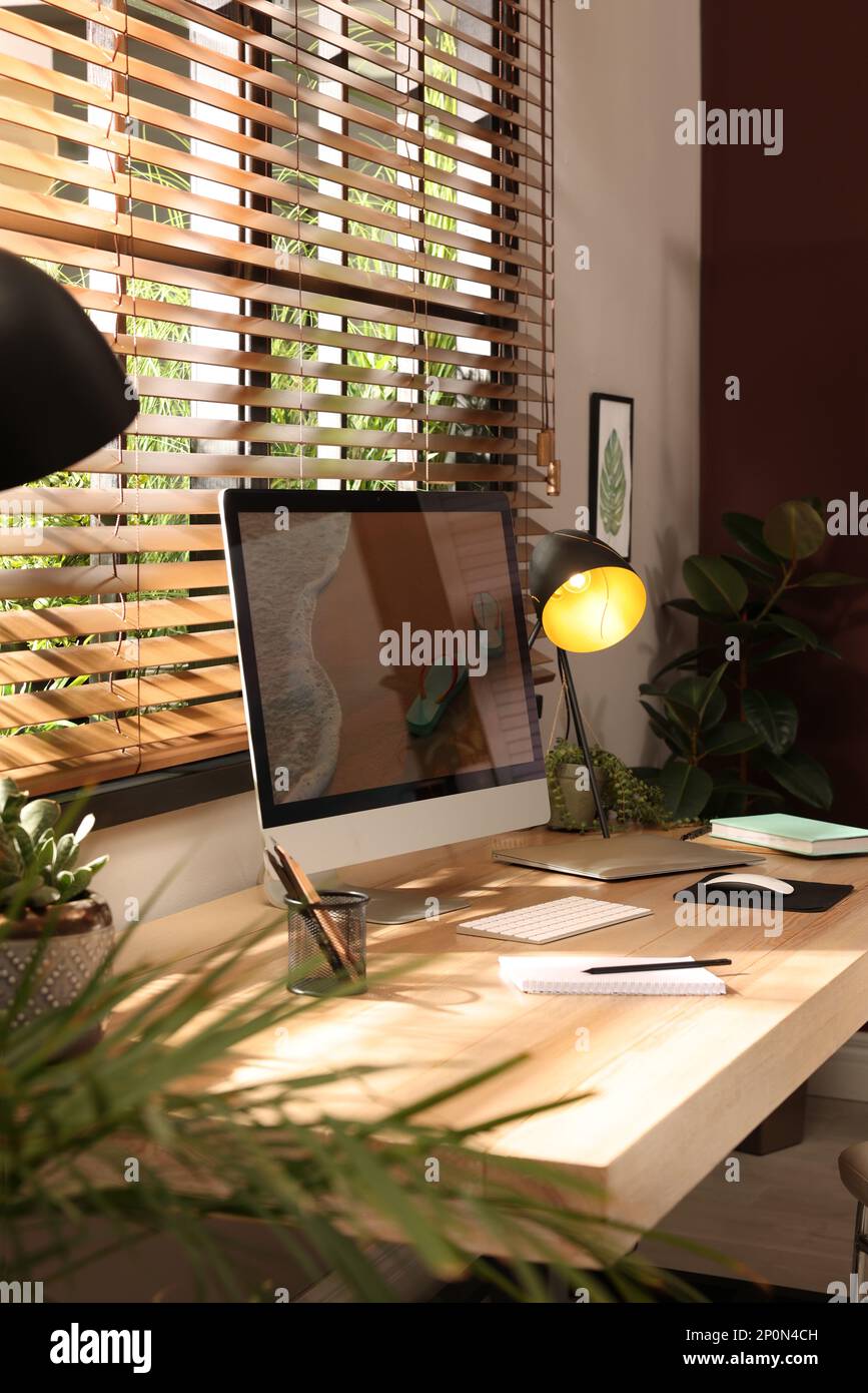 Comfortable workplace near window in room. Interior design Stock Photo ...