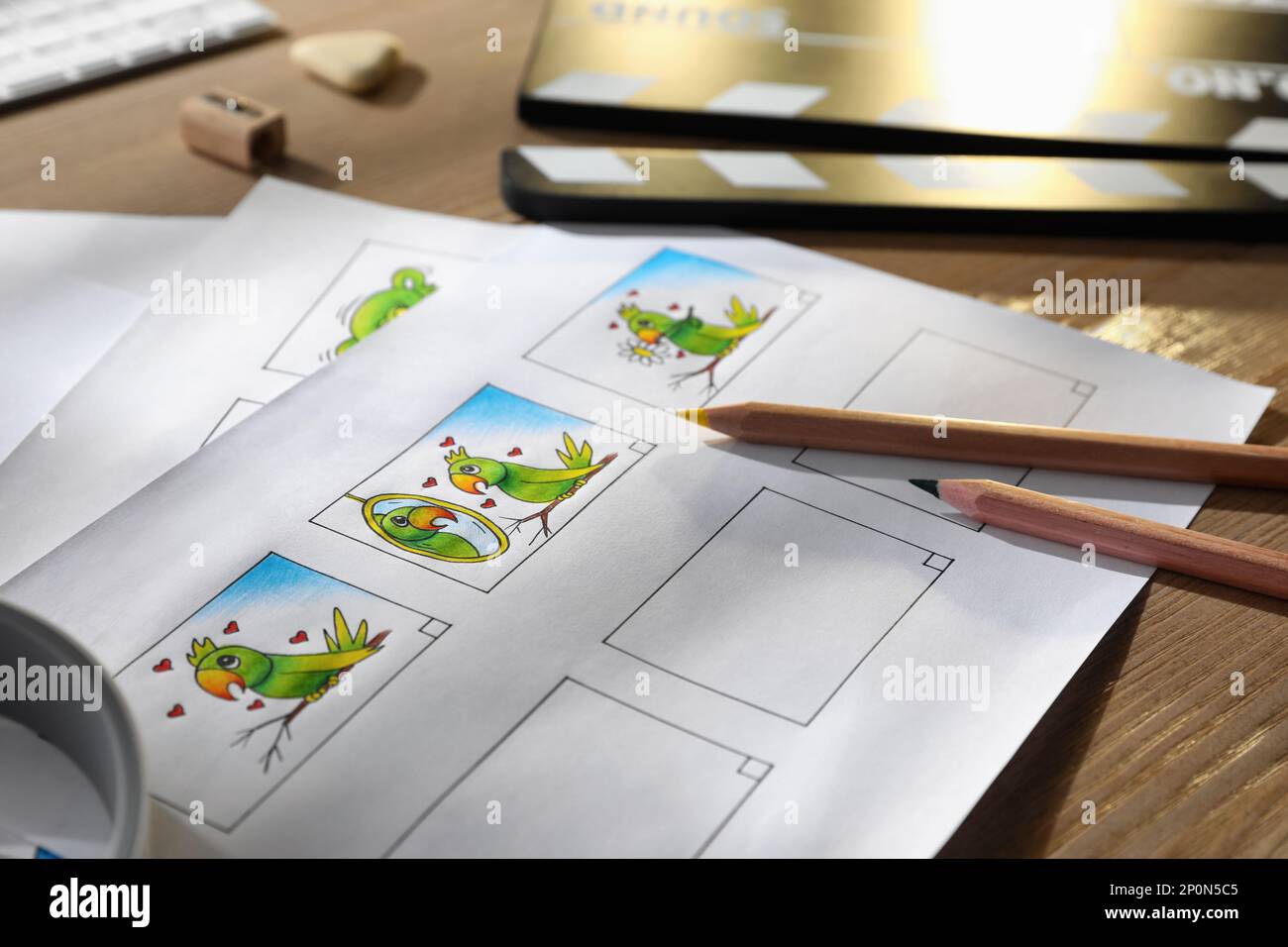 Storyboards with cartoon sketches at workplace, closeup. Pre-production ...
