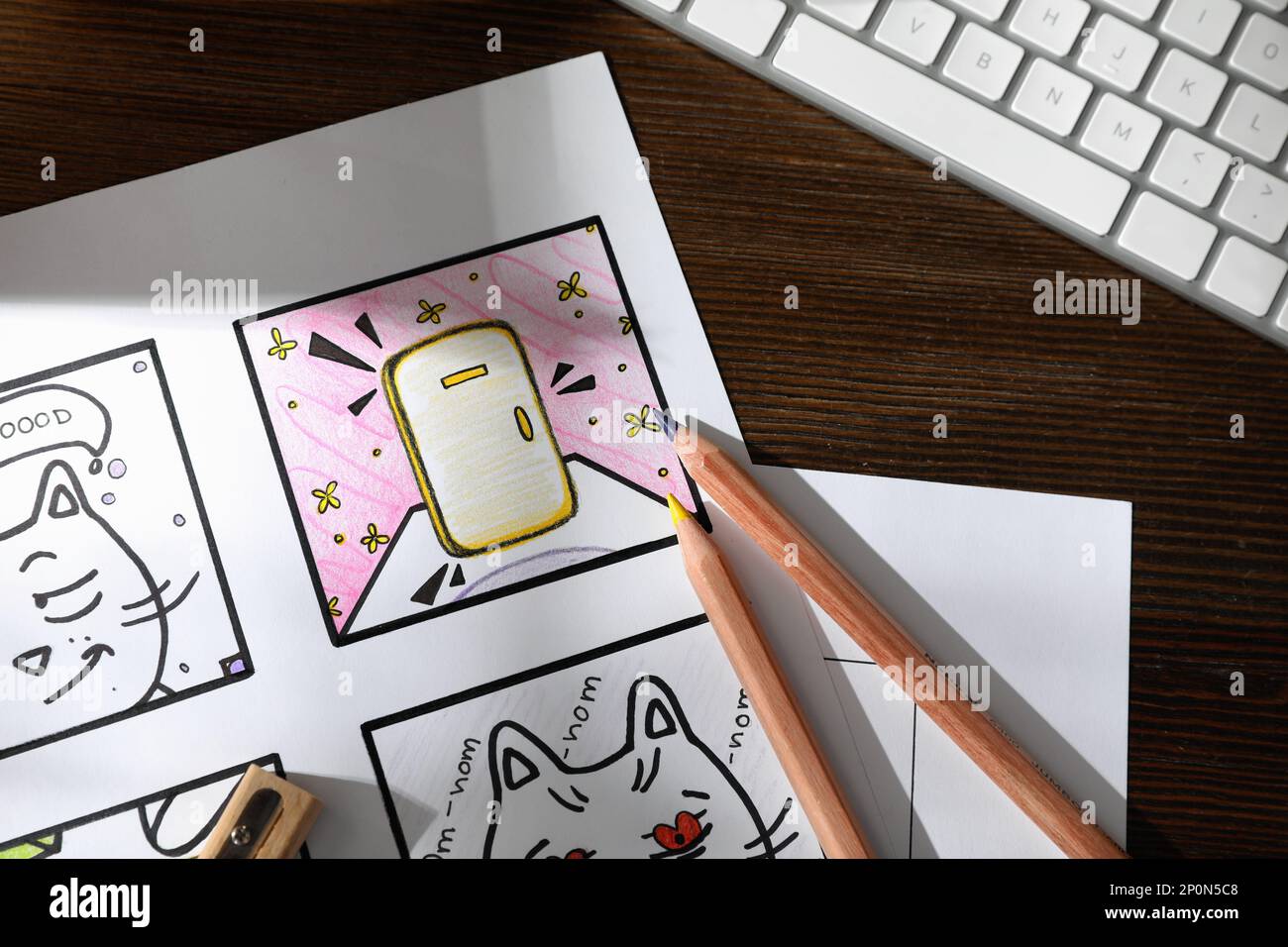 Storyboard with cartoon sketches at workplace, flat lay. Pre-production ...