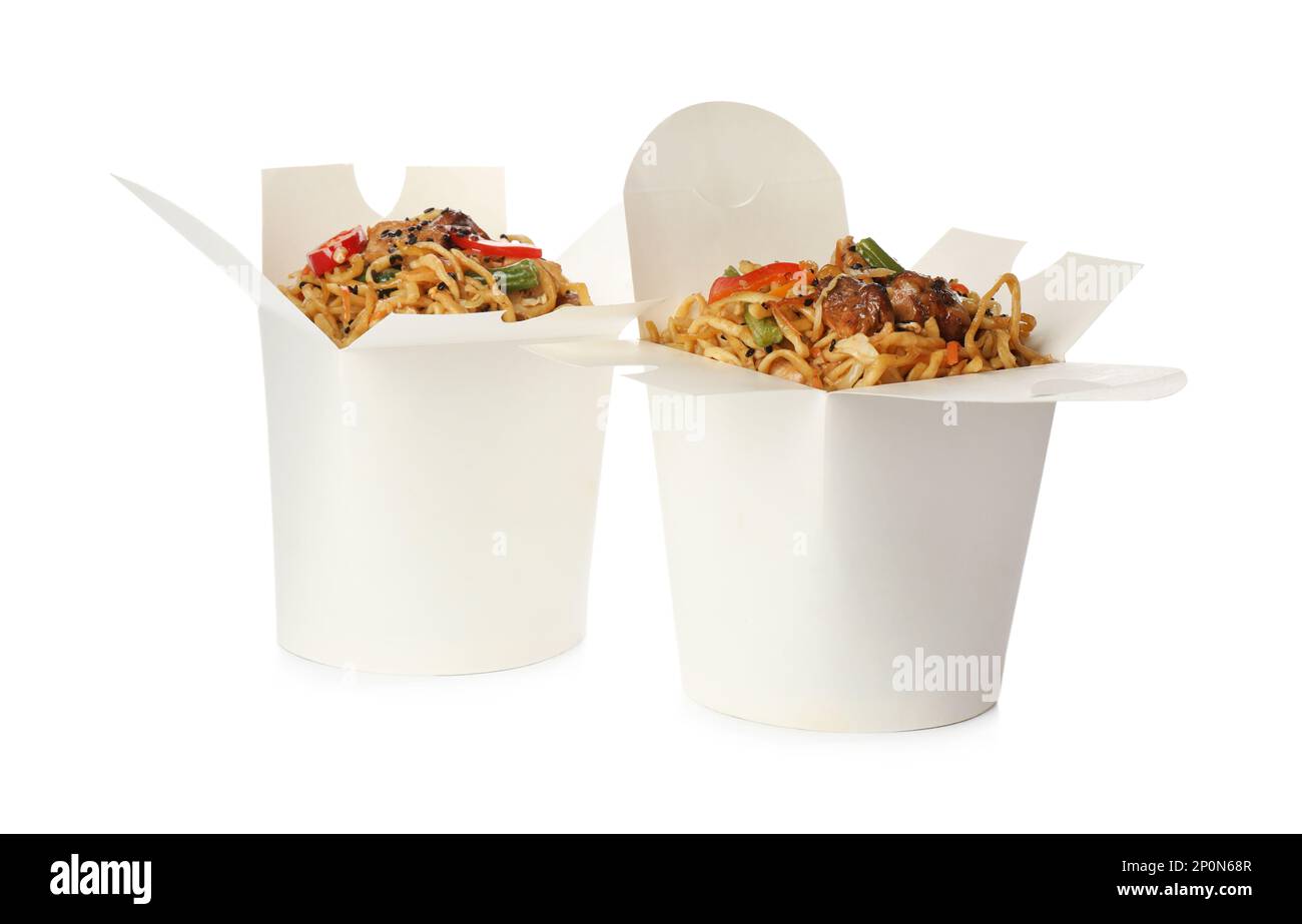 Boxes of wok noodles with vegetables and meat isolated on white Stock ...