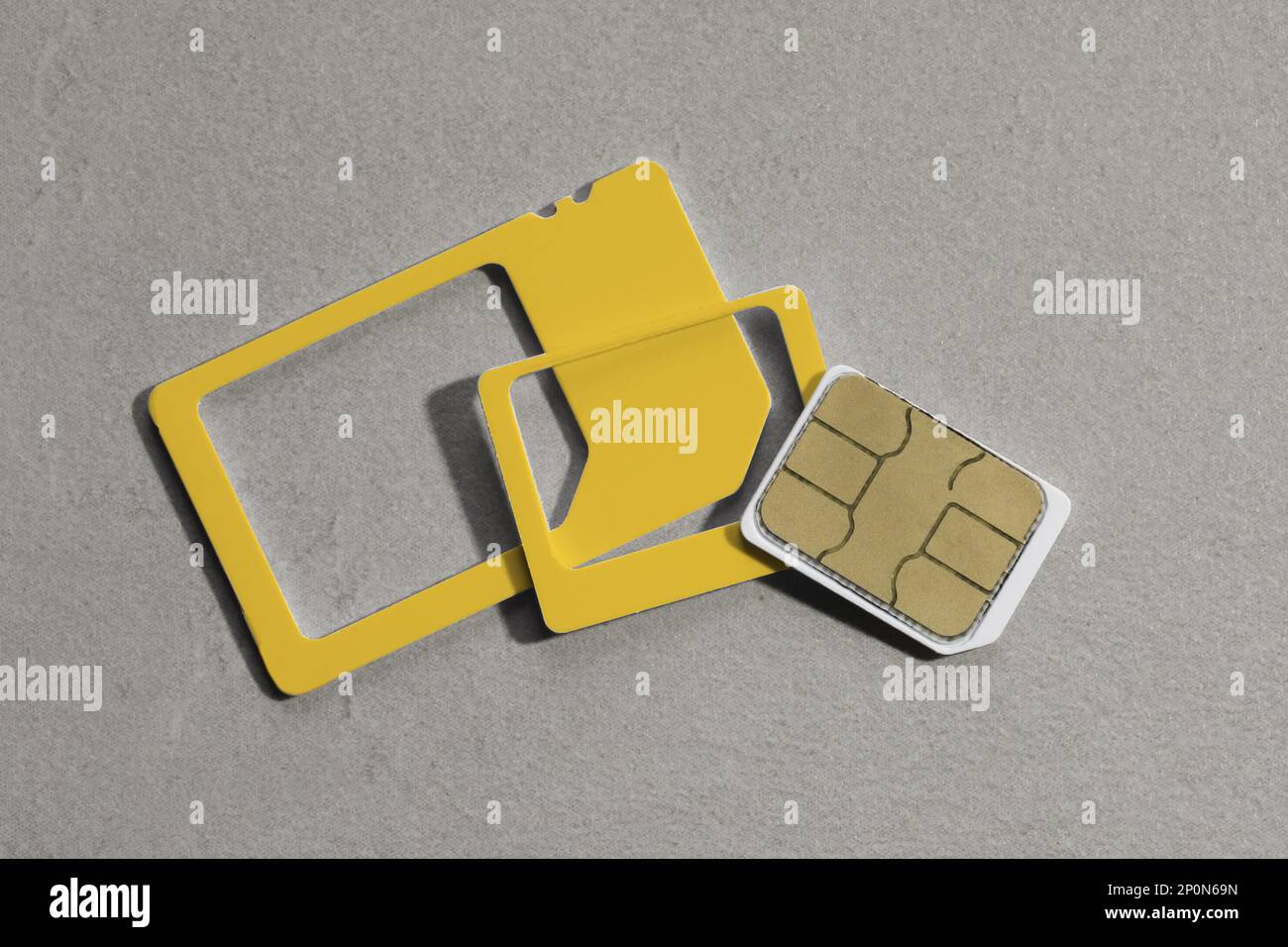 Multi SIM card on light grey stone background, flat lay Stock Photo - Alamy