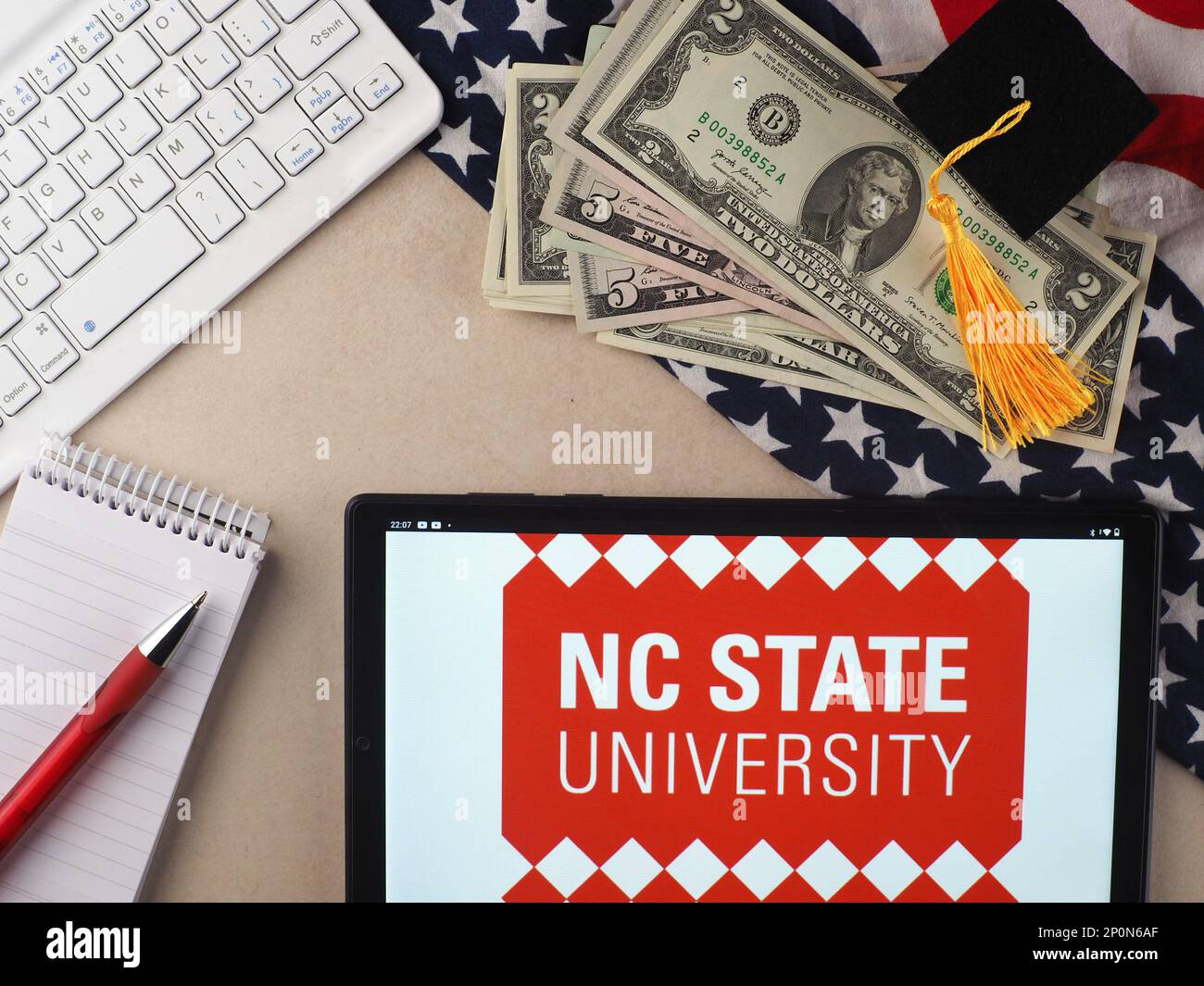 In this photo illustration, North Carolina State University logo seen ...