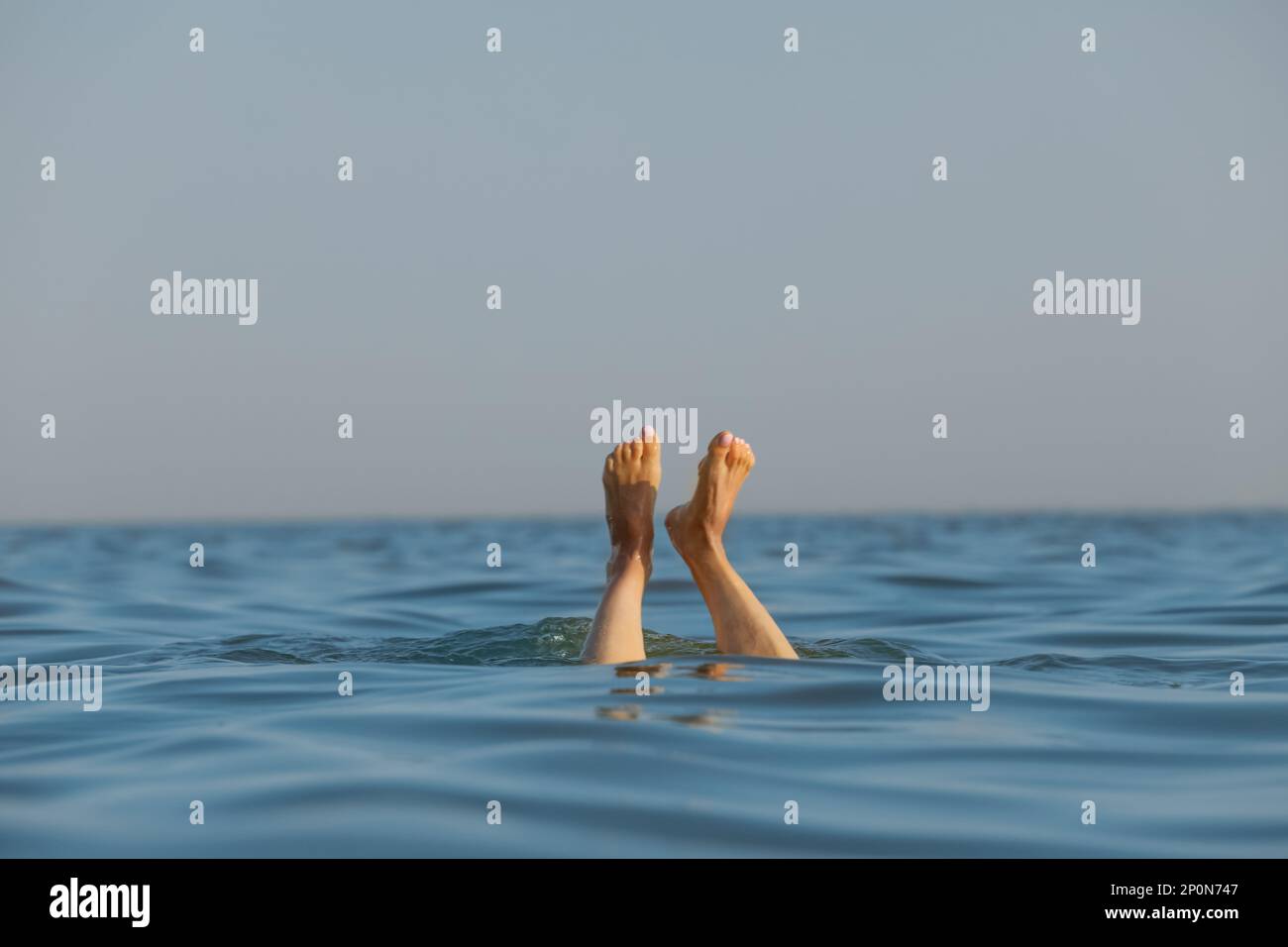 Feet sticking out of water hi-res stock photography and images - Alamy