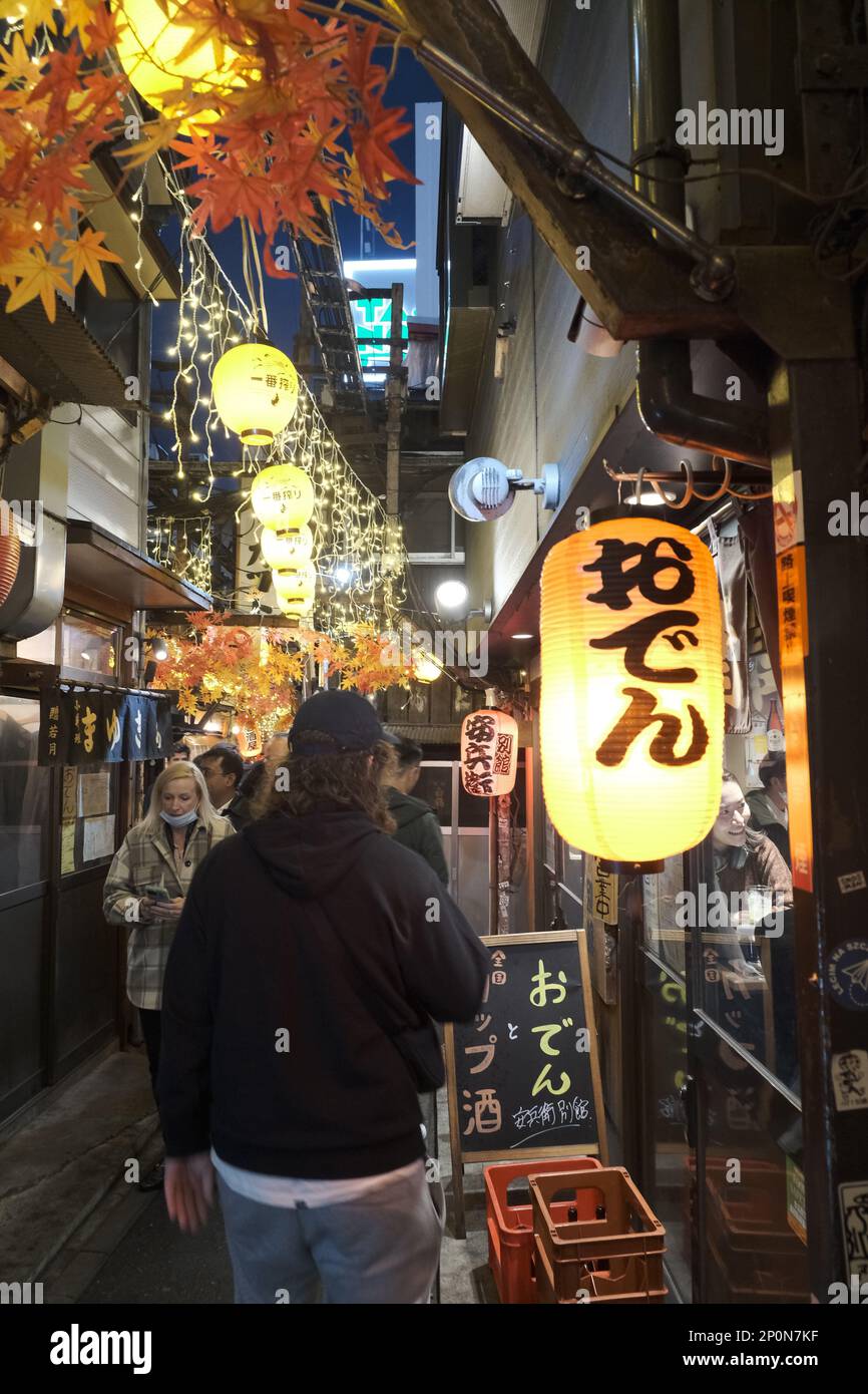 Small alleyway in Japan full of restaurants and people Stock Photo - Alamy