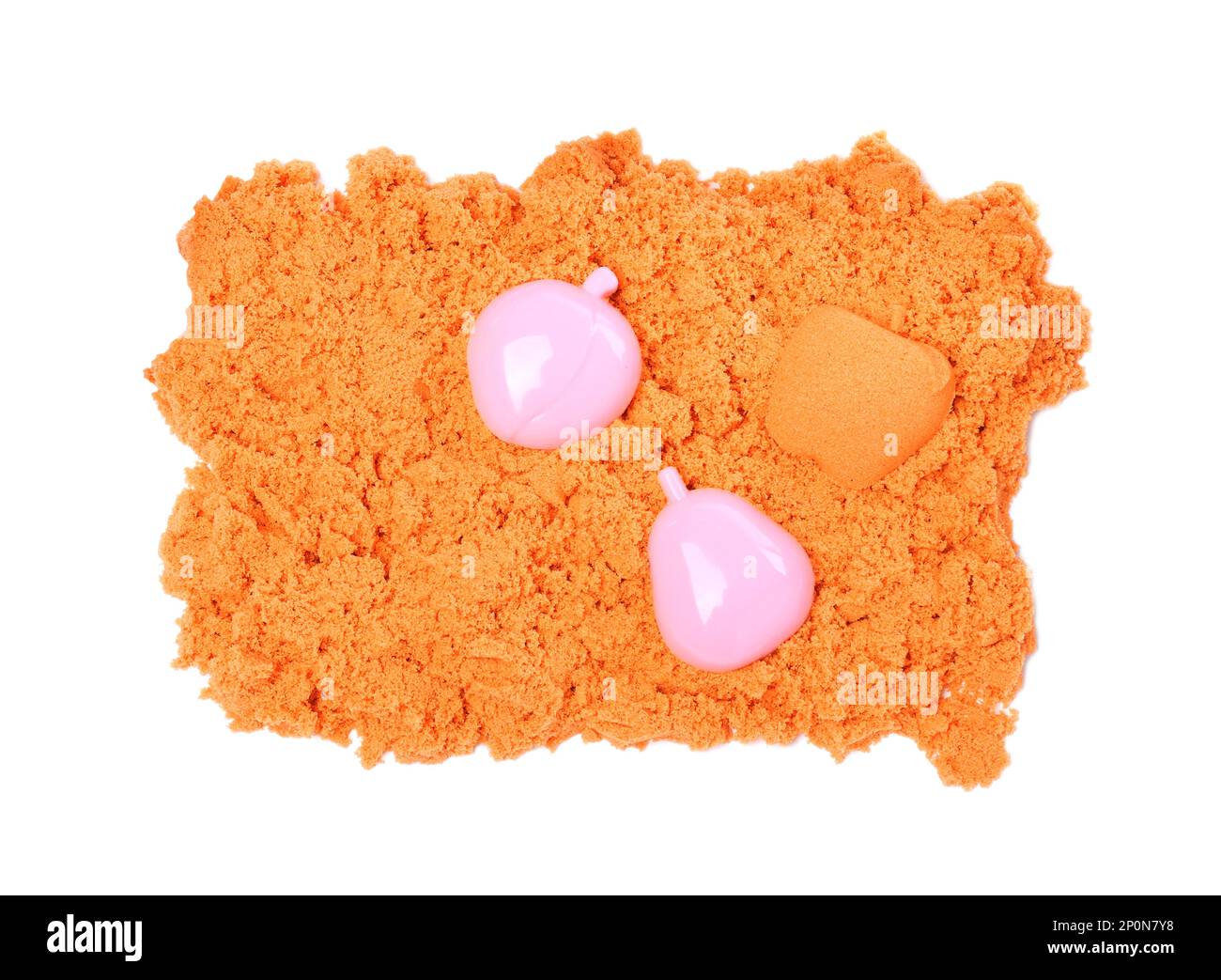 Orange kinetic sand and toys on white background, top view Stock Photo ...