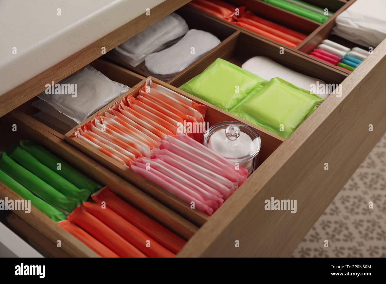 Storage of different feminine hygiene products in wooden drawer ...