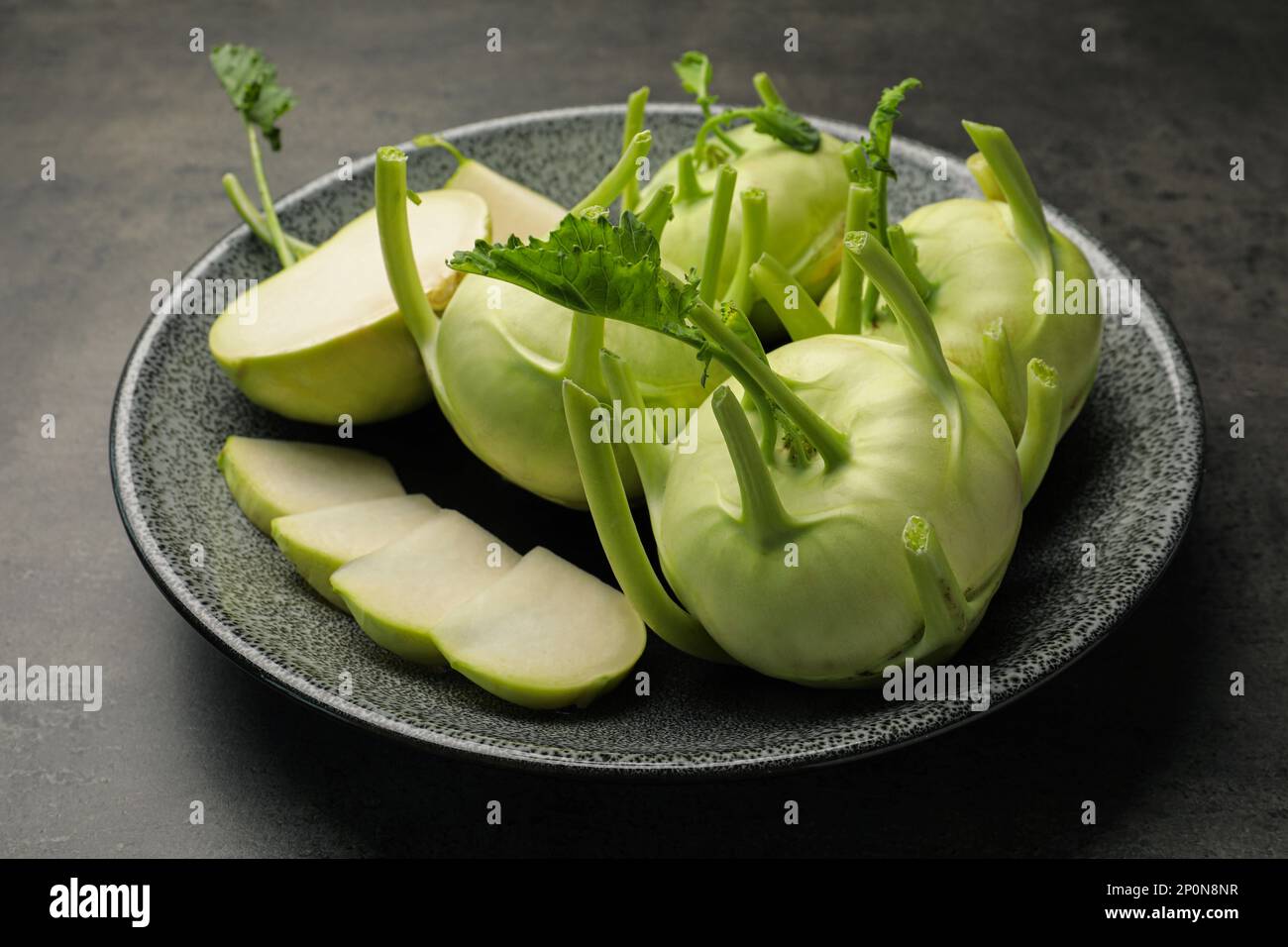 Whole and cut kohlrabi plants on grey table Stock Photo - Alamy