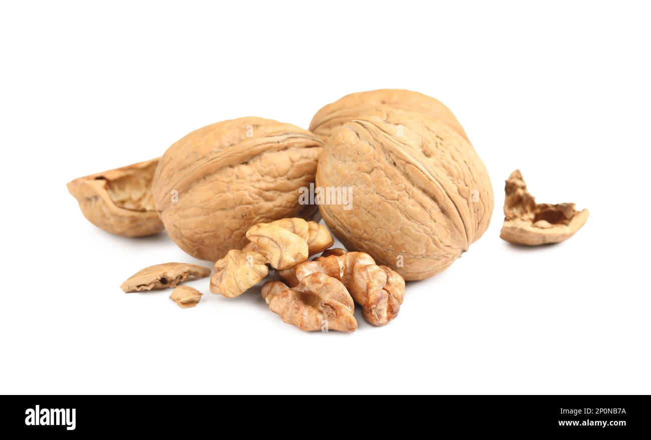 Fresh ripe walnuts and shell on white background Stock Photo - Alamy