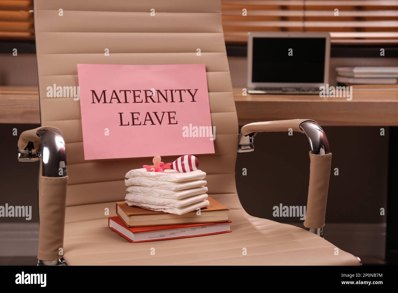 Baby care accessories, notebooks and note with text Maternity Leave on ...
