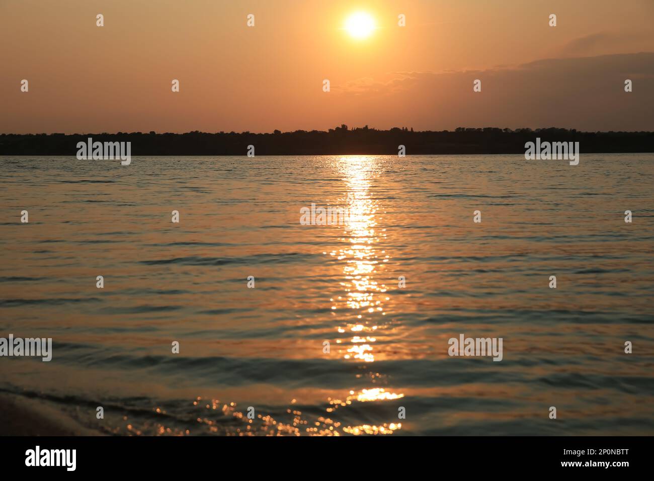 Landscape with beautiful sunset over calm river Stock Photo - Alamy