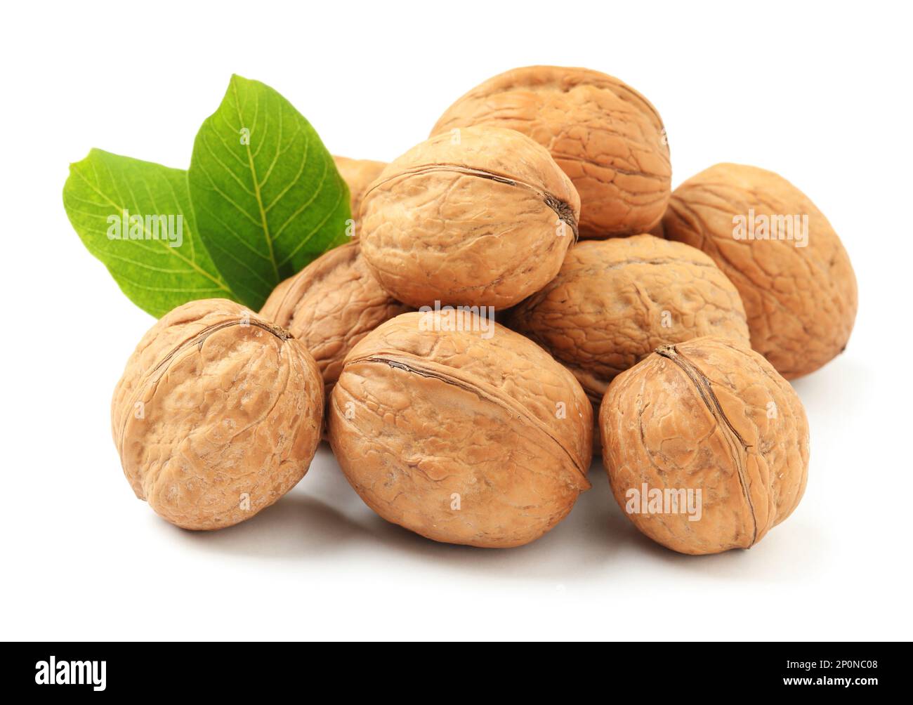 Whole walnuts in shell and leaves on white background Stock Photo - Alamy
