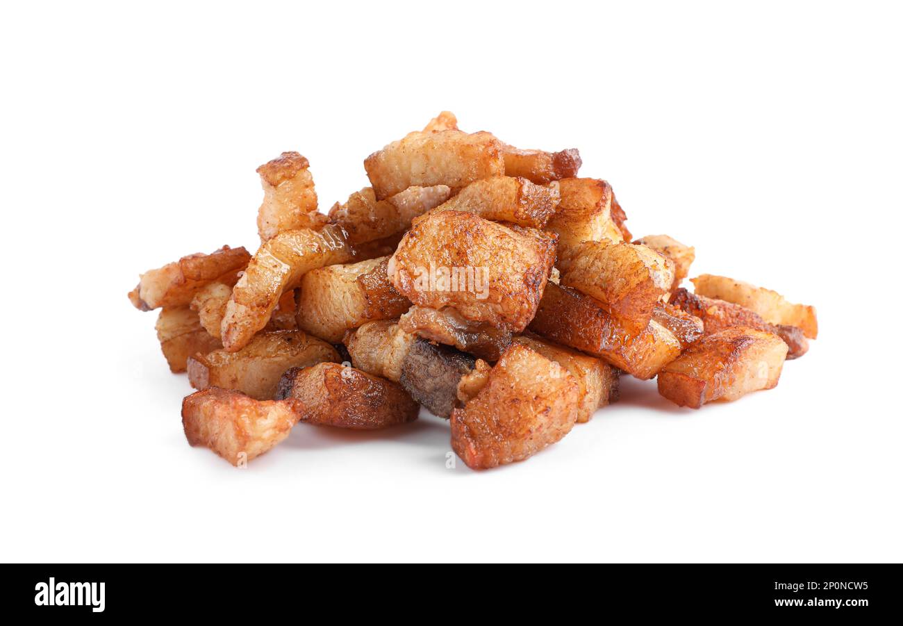 Tasty fried cracklings on white background. Cooked pork lard Stock ...