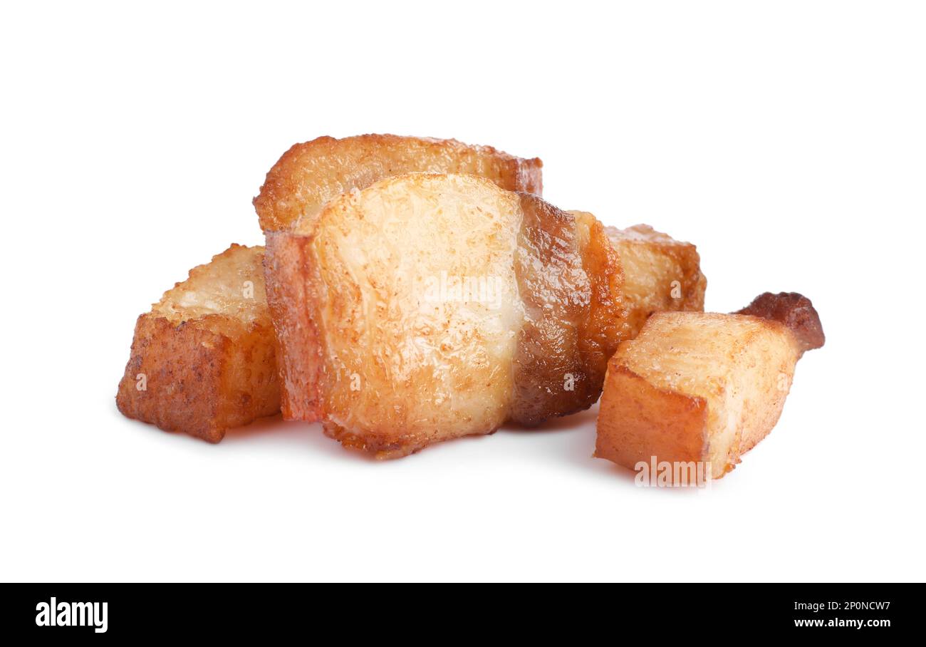 Tasty fried cracklings on white background. Cooked pork lard Stock ...