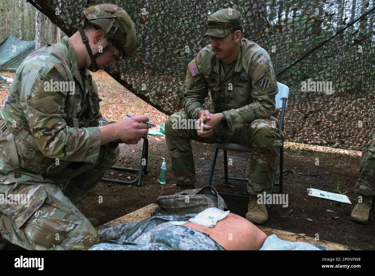 A Soldier assigned to 3rd Infantry Division asses a simulated casualty ...
