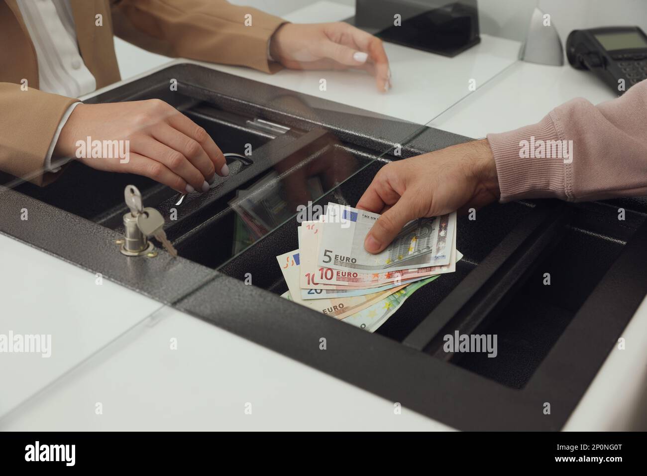 Man giving money to cashier in bank, closeup. Currency exchange Stock ...
