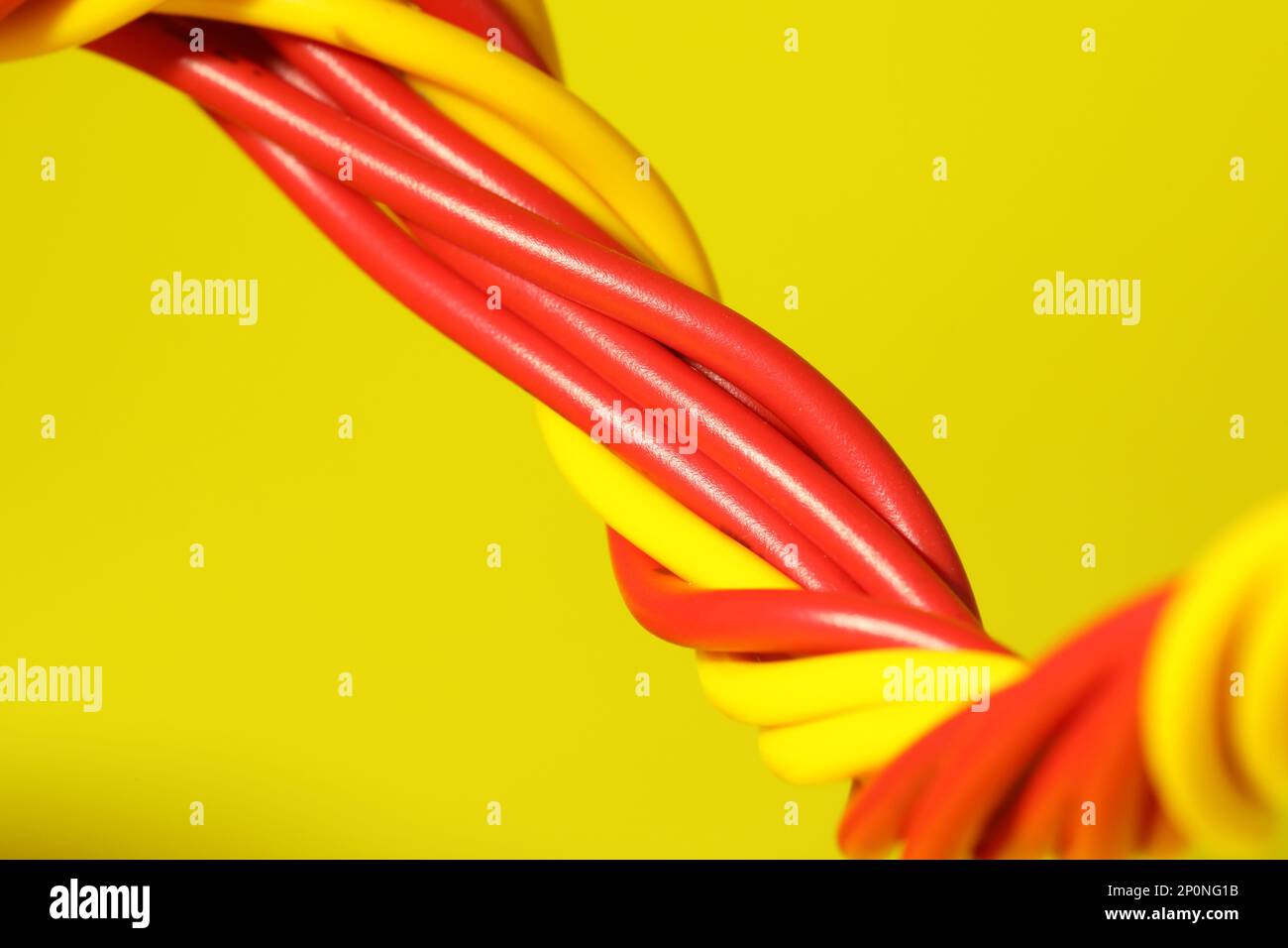 Electrical wires on yellow background, closeup view Stock Photo - Alamy